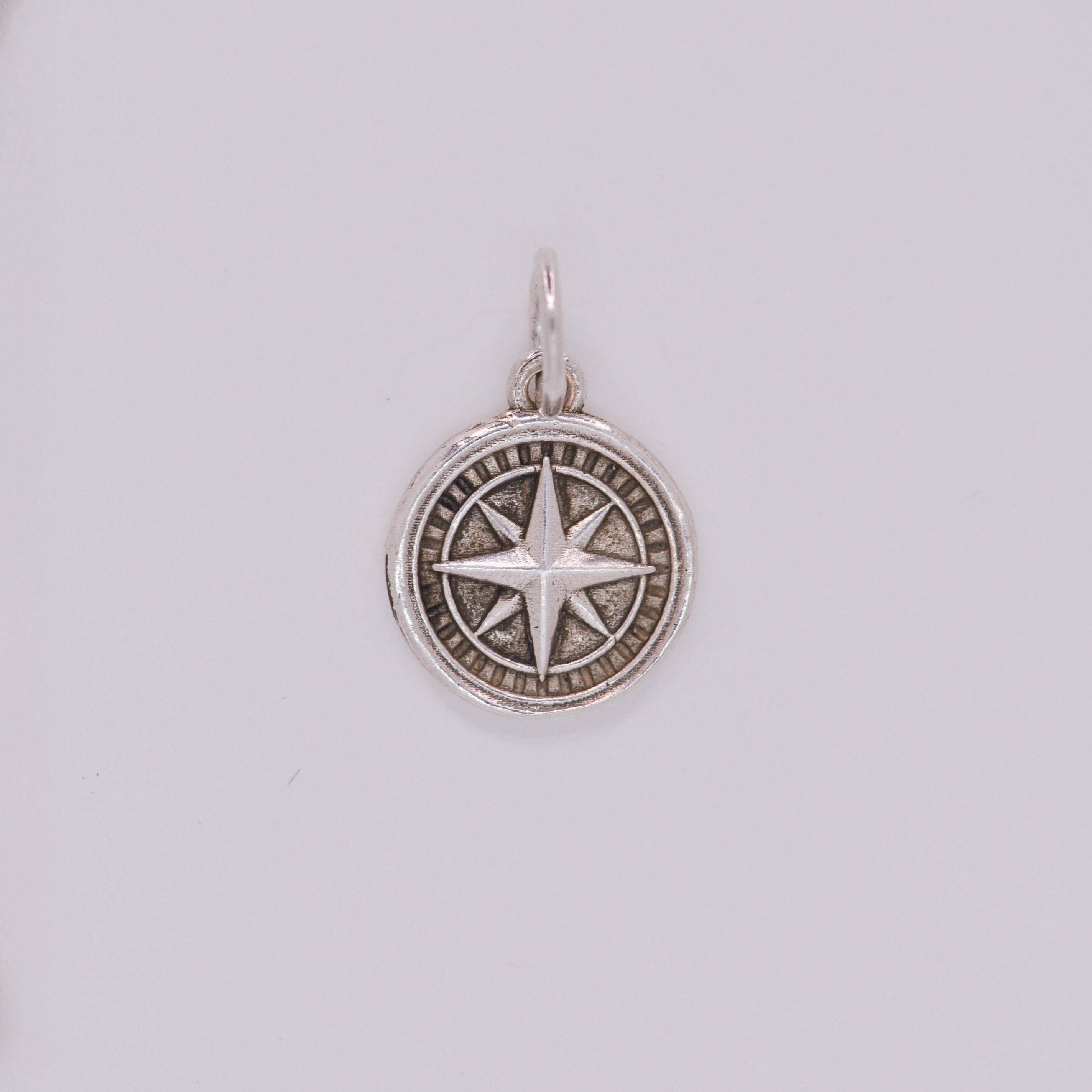 The Compass Charm – Pretty Steep